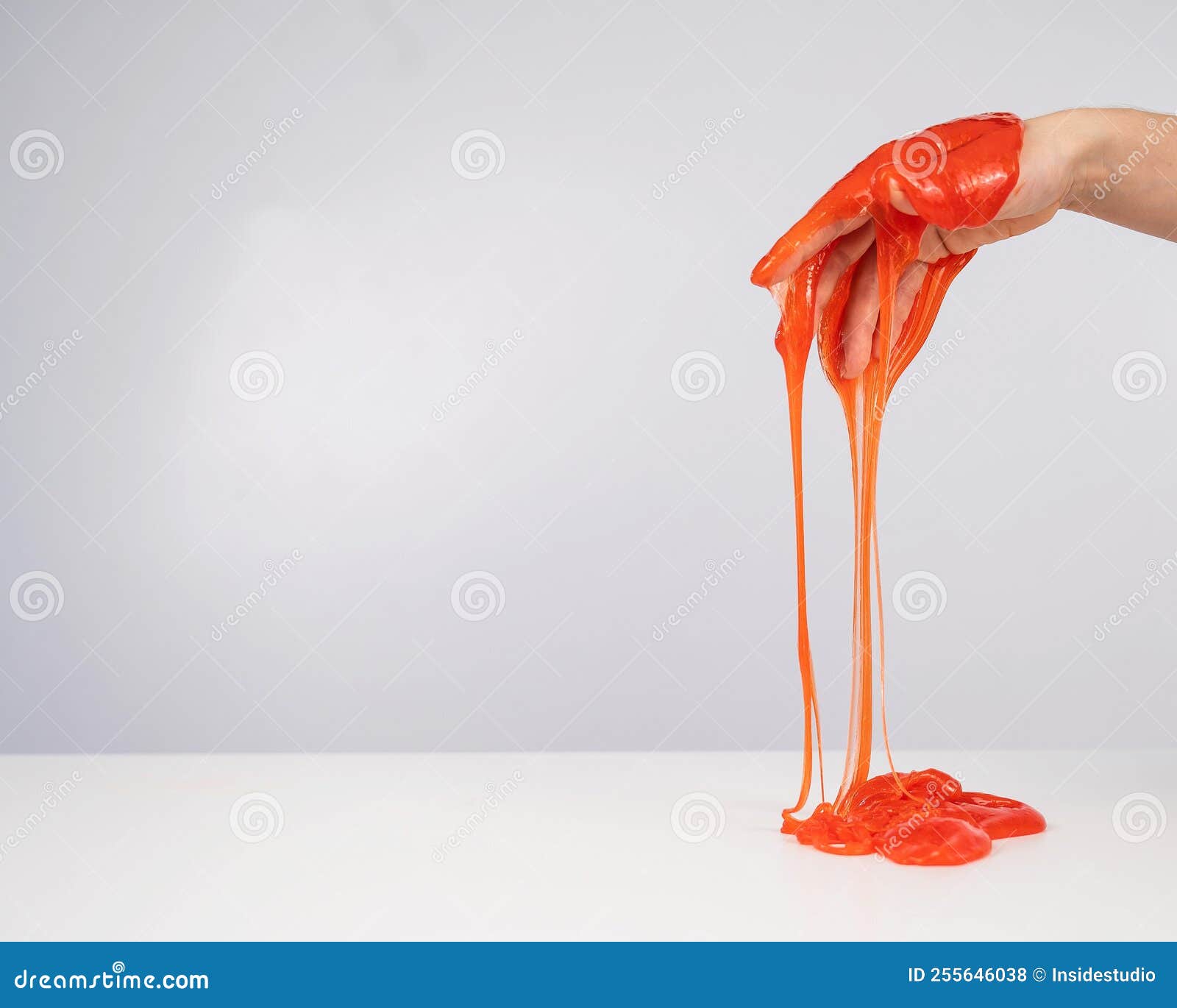 Red Slime Flowing Down from a Woman& X27;s Hand on a White Background ...