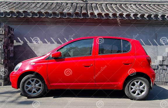 Red small car and wall stock photo. Image of architecture - 5255448