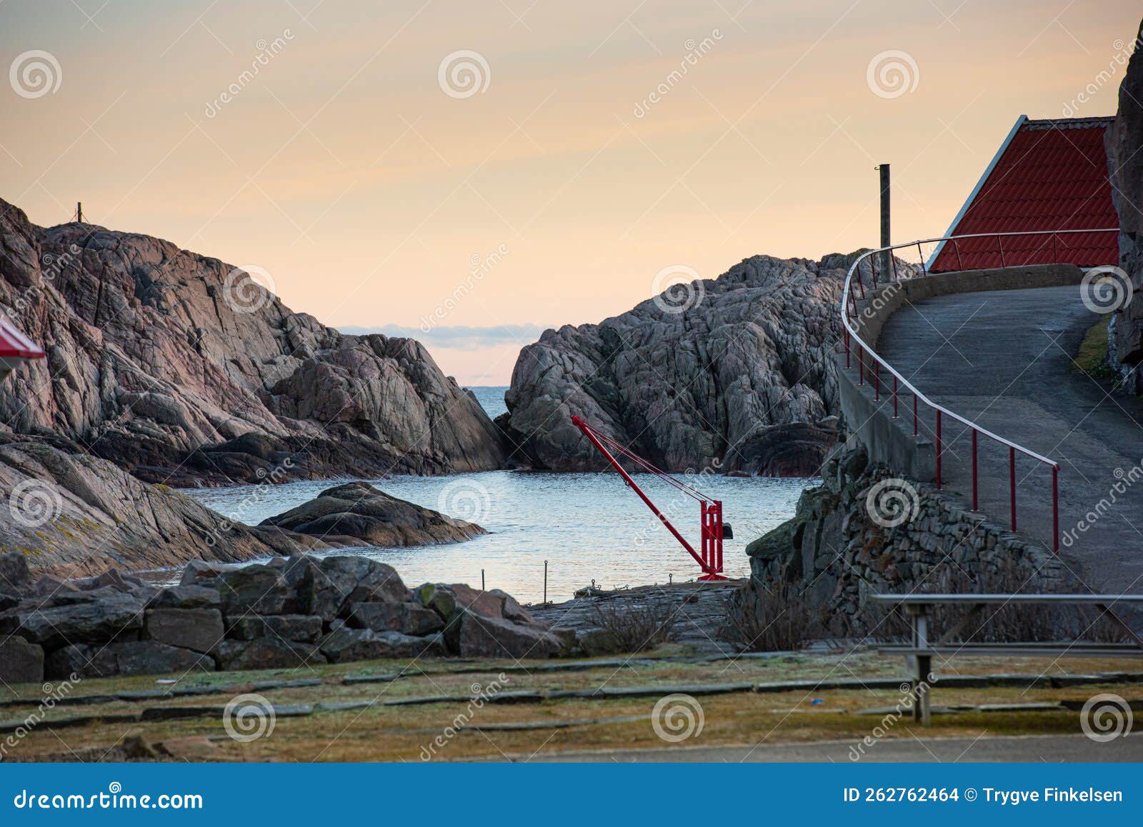 Red Small Crane at Docks. Rough Cliffs in the Background.. Editorial ...