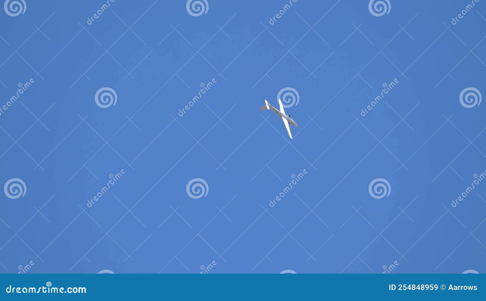 Red Small Sport Plane Flying in the Sky Pulls on a Rope the Glider ...