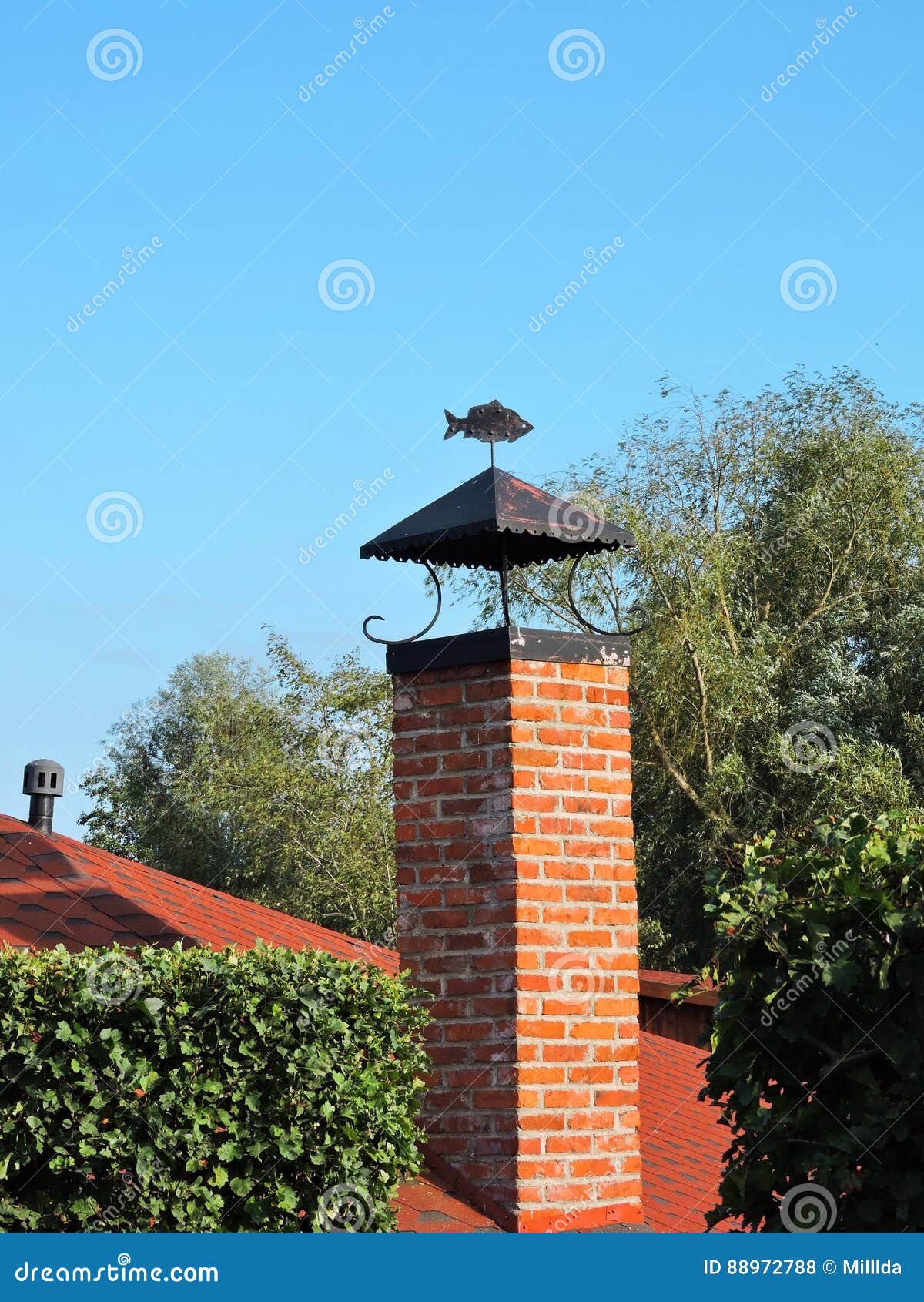 Red Smokestack and Metallic Fish on Top Stock Photo - Image of texture ...