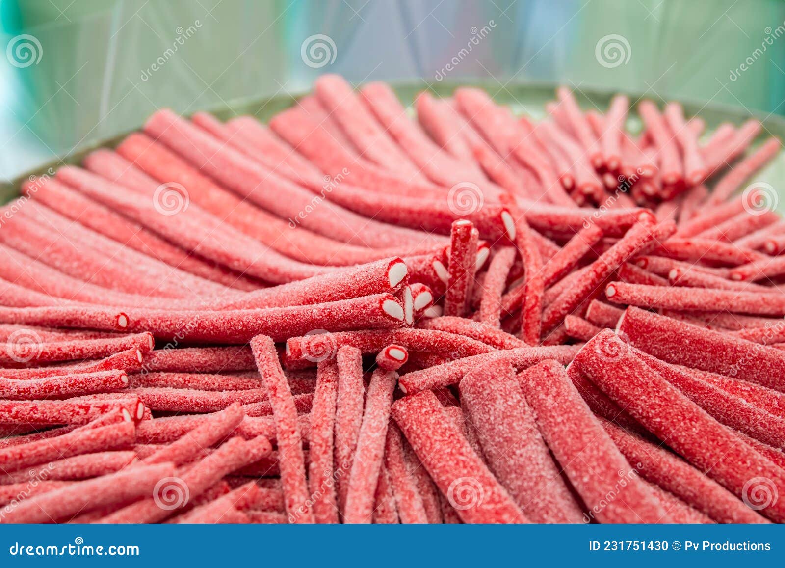 Red Sour Gummy Sticks Coated with Sugar in a Candy Store Stock Photo ...