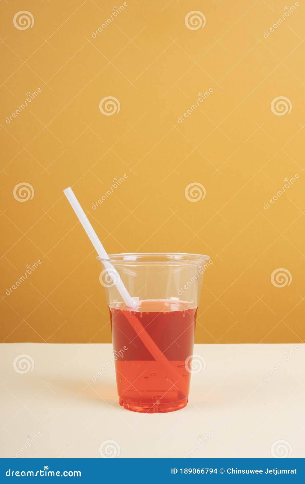 Red Sparkling Water in Plastic Cup with Straw on Table Stock Photo ...