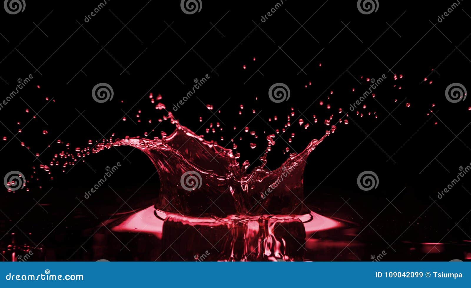 Red splash on a black stock image. Image of liquor, ripple - 109042099