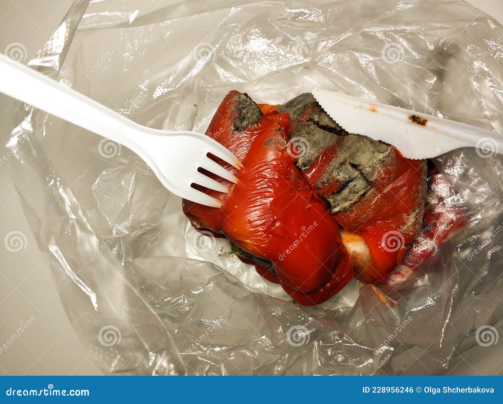 Red Spoiled Peppers in a Bag with a Plastic Knife and Fork. Problems of ...