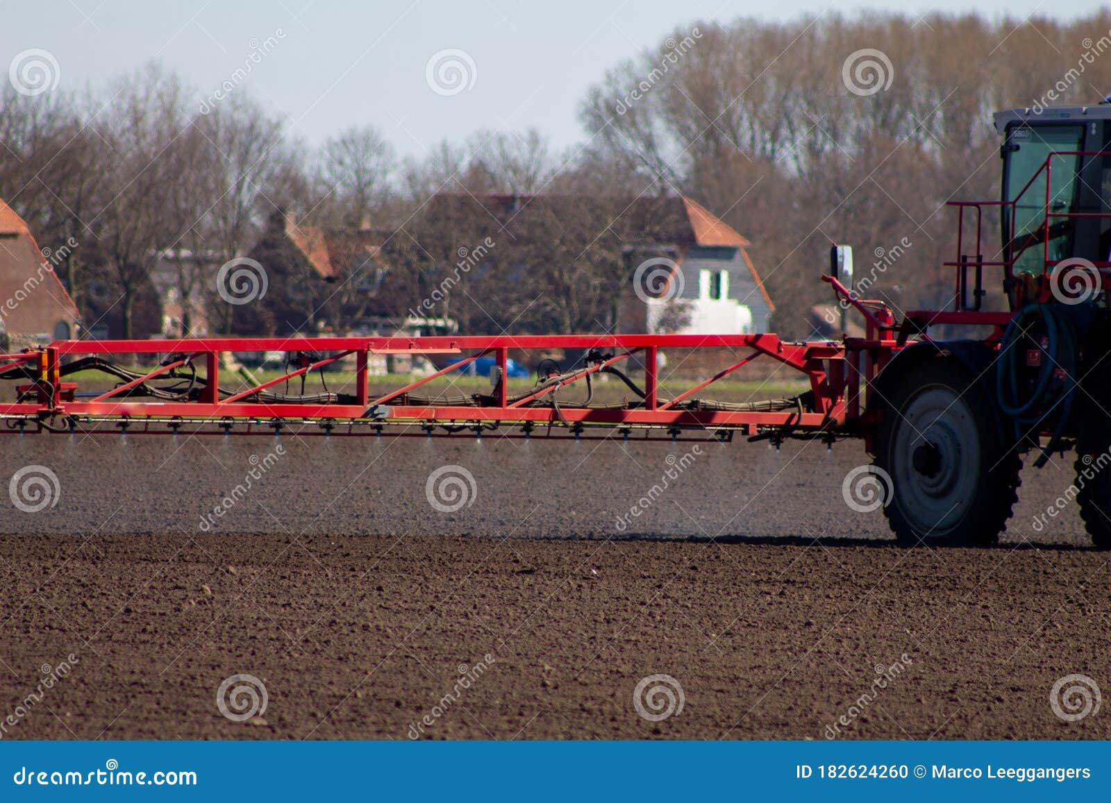 Red Spray Beam Sprinkler Beam Tractor Rides Stock Photo - Image of ...