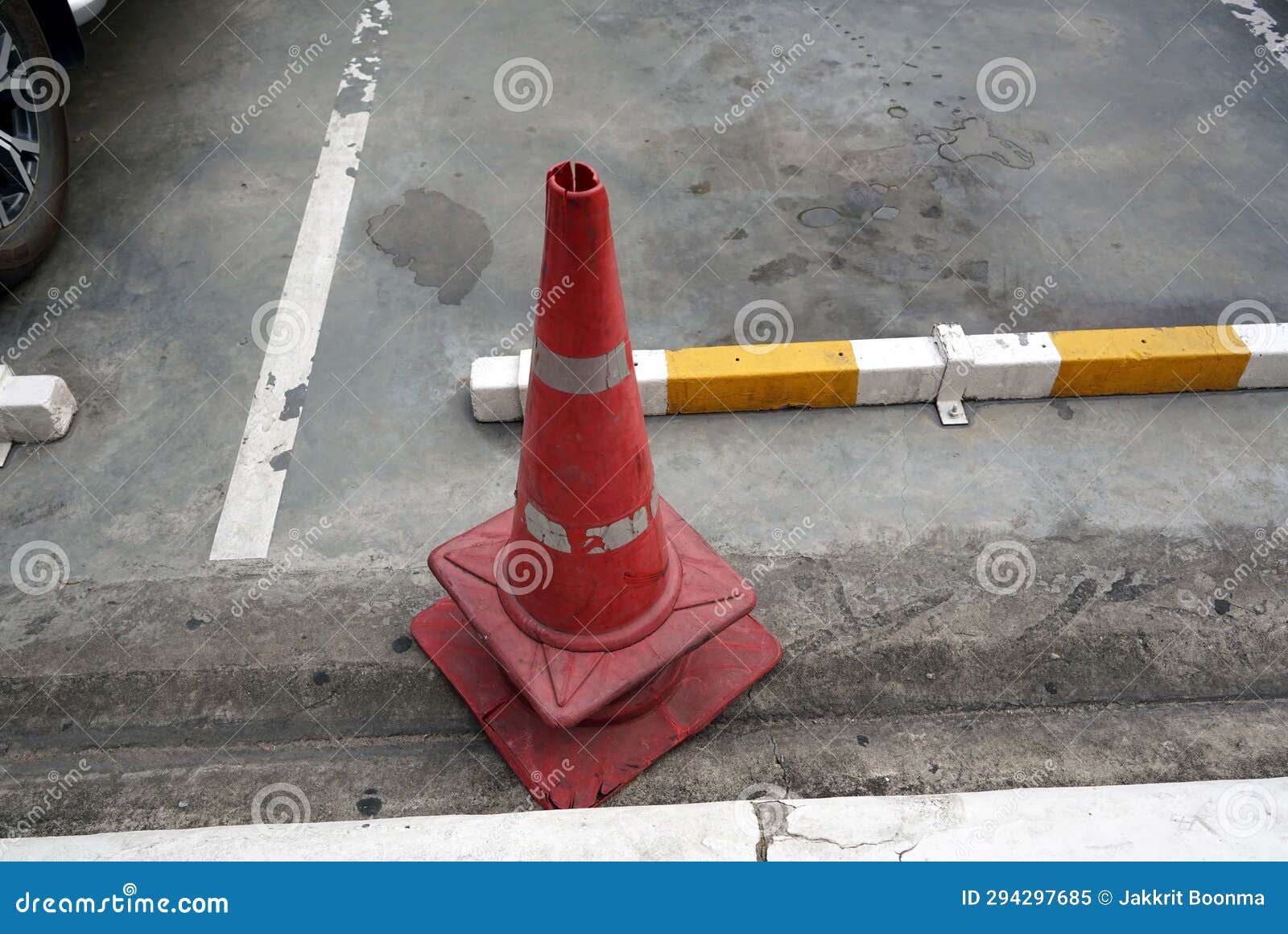 A Red Stack Two Traffic Cones Near a Cement Bar Blocks on the Carpark ...
