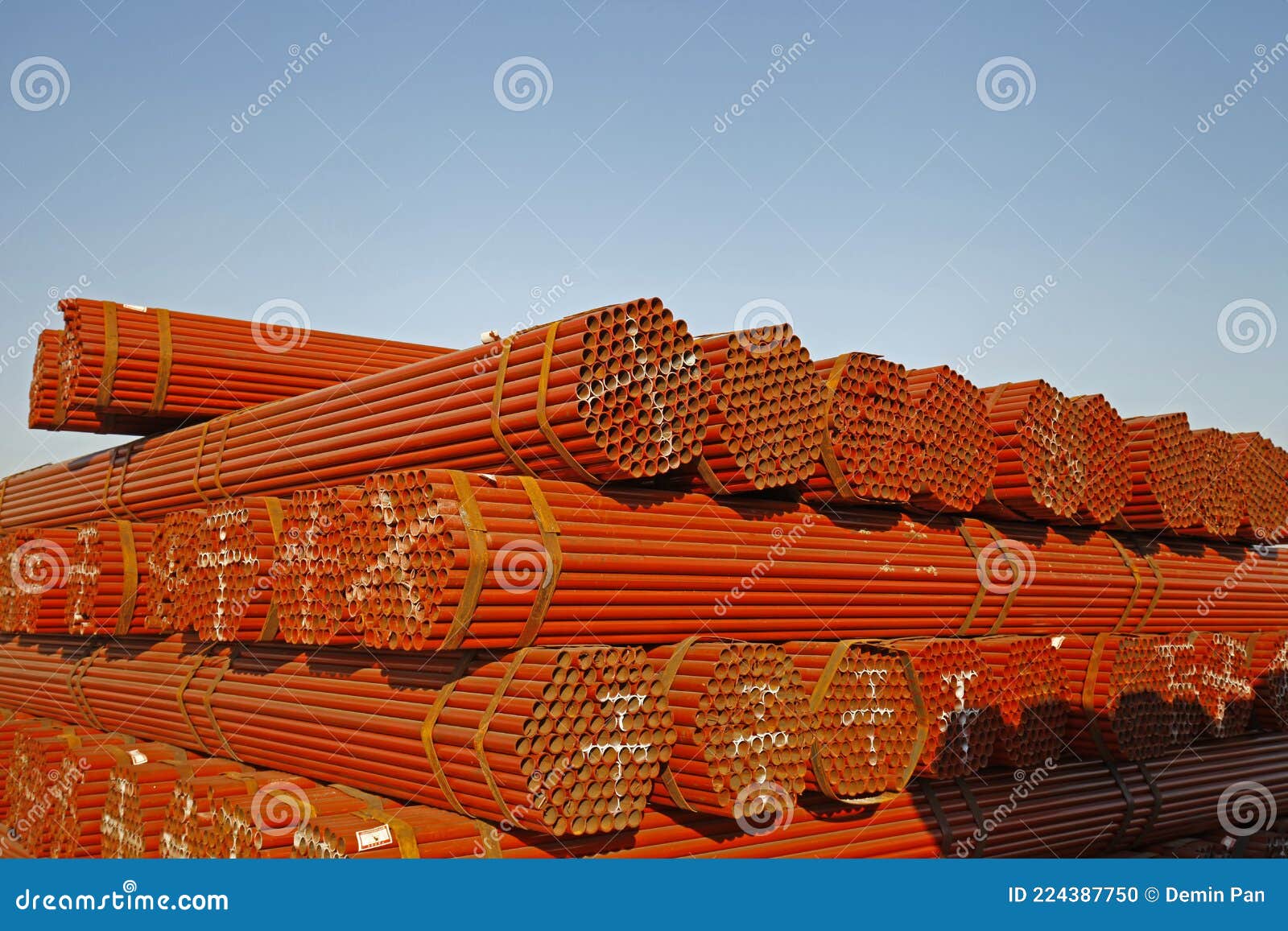 Red stacked steel pipe stock photo. Image of culvert - 224387750