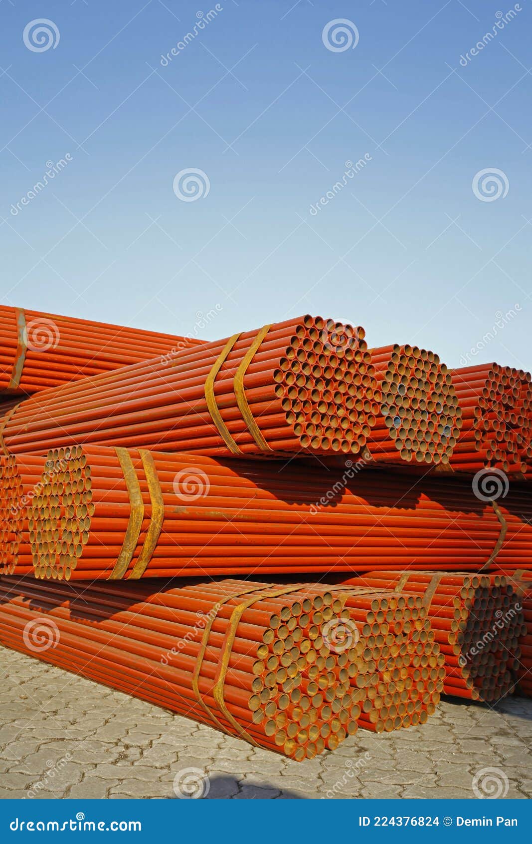 Red stacked steel pipe stock photo. Image of abstract - 224376824