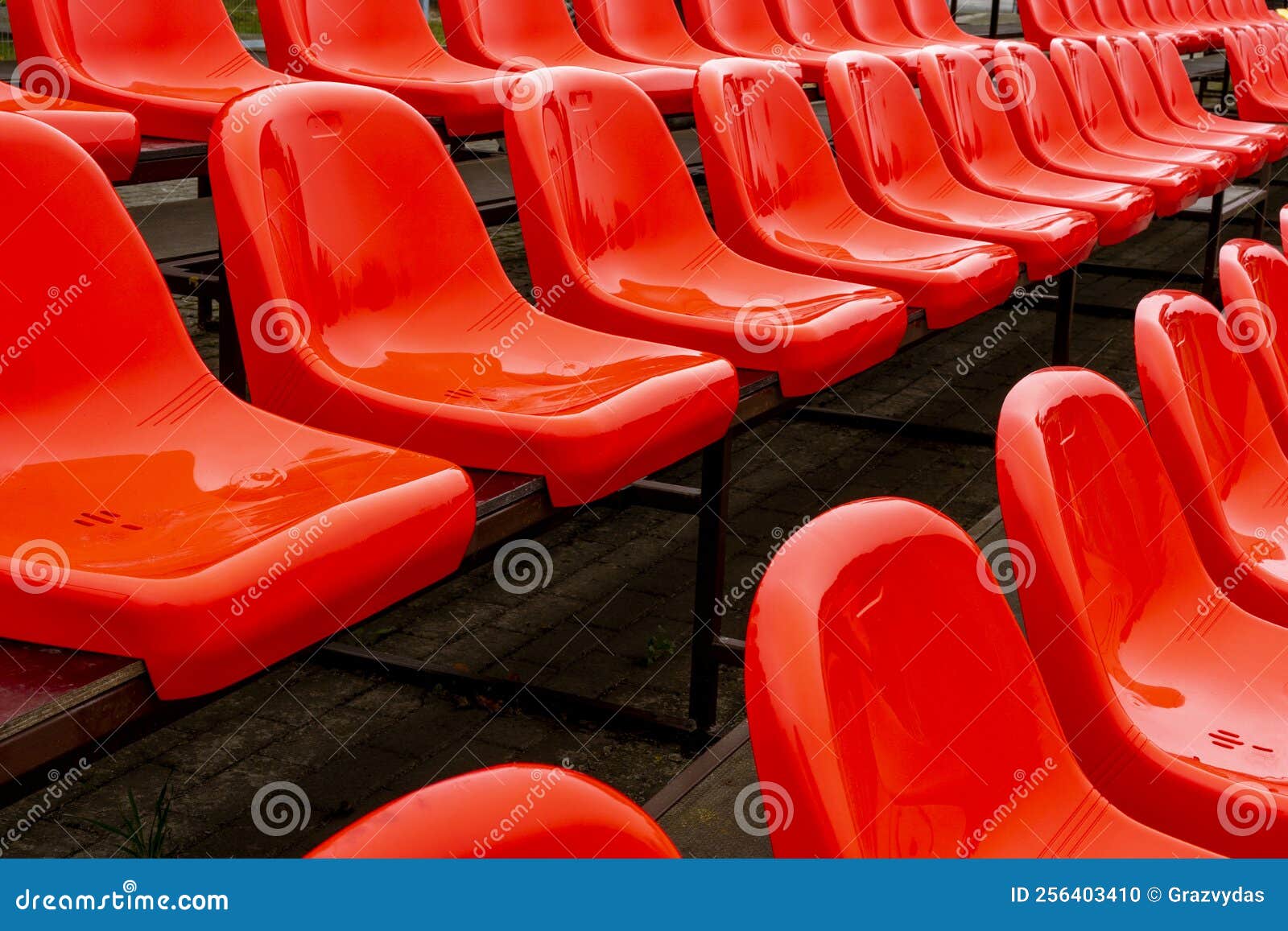 Red stadium seats stock photo. Image of plastic, football - 256403410