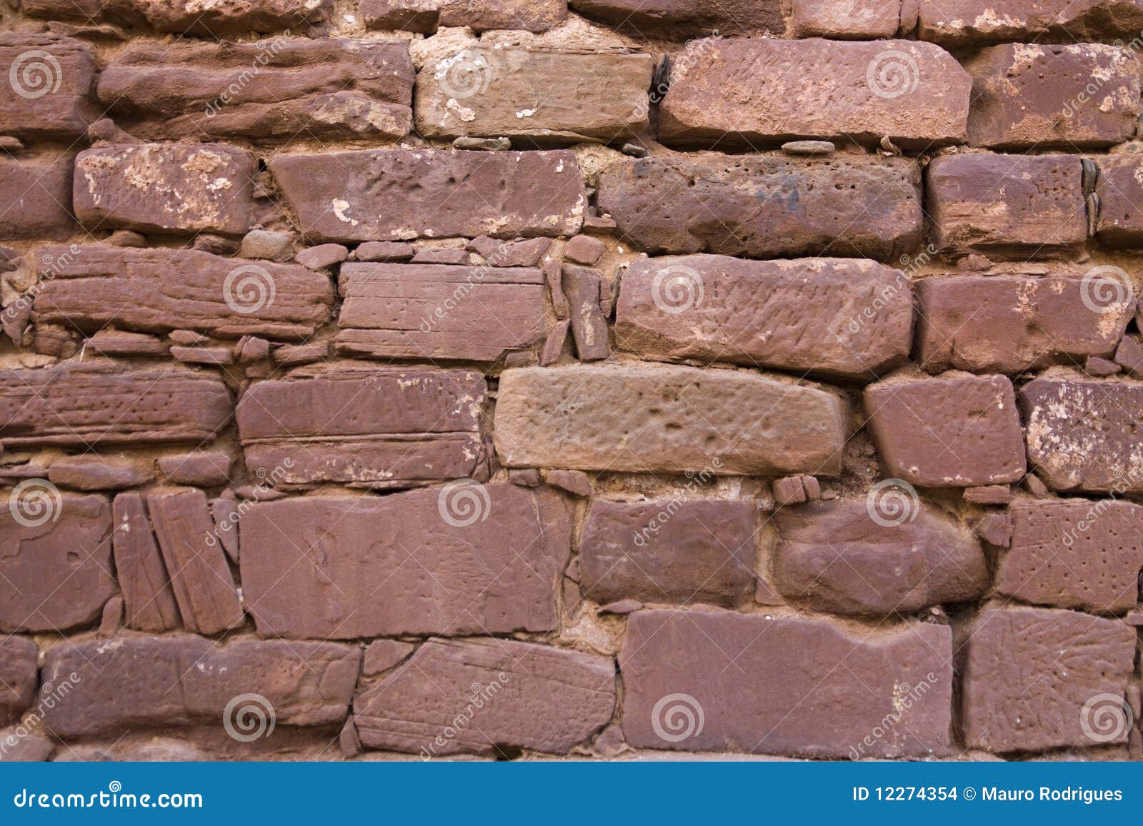 Red stone wall stock photo. Image of surface, stone, fortification ...