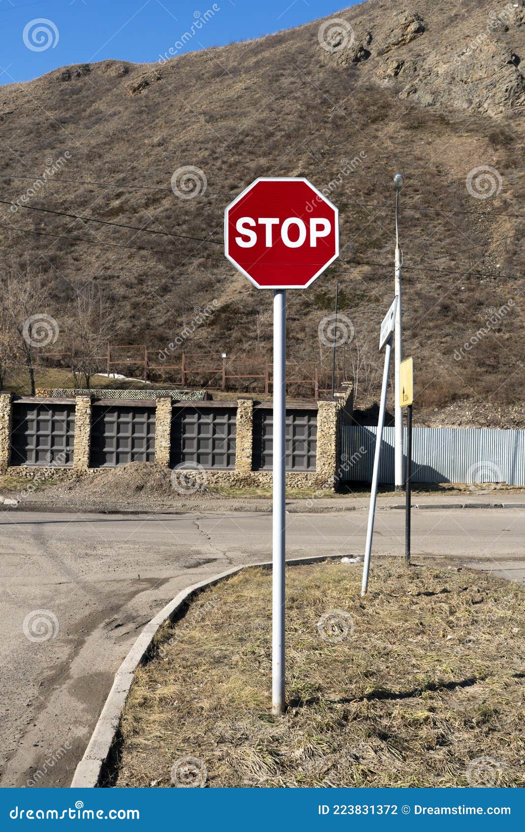 Red Stop Road Sign at the Corner of an Intersection. Stock Photo ...