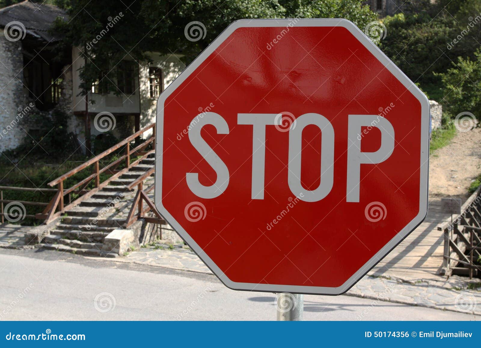 Red Stop Sign on a Stone Road Stock Photo - Image of caution, sign ...