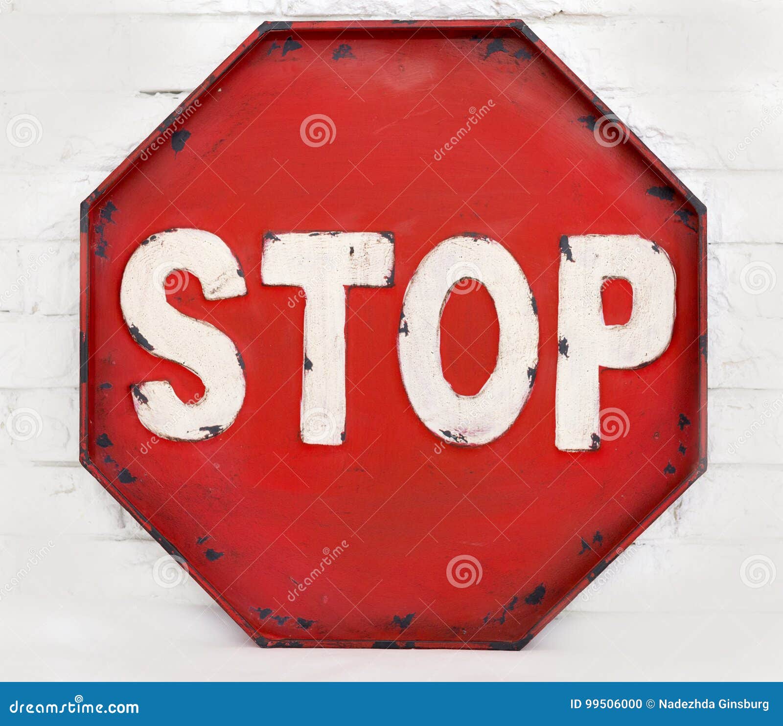 Red Stop Symbol on a White Brick Wall, Object. Stock Photo - Image of ...