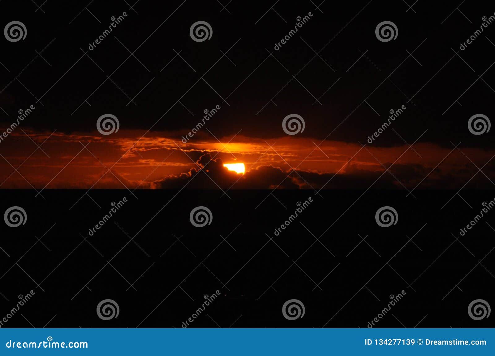 Red sun in the clouds stock image. Image of yellow, bright - 134277139