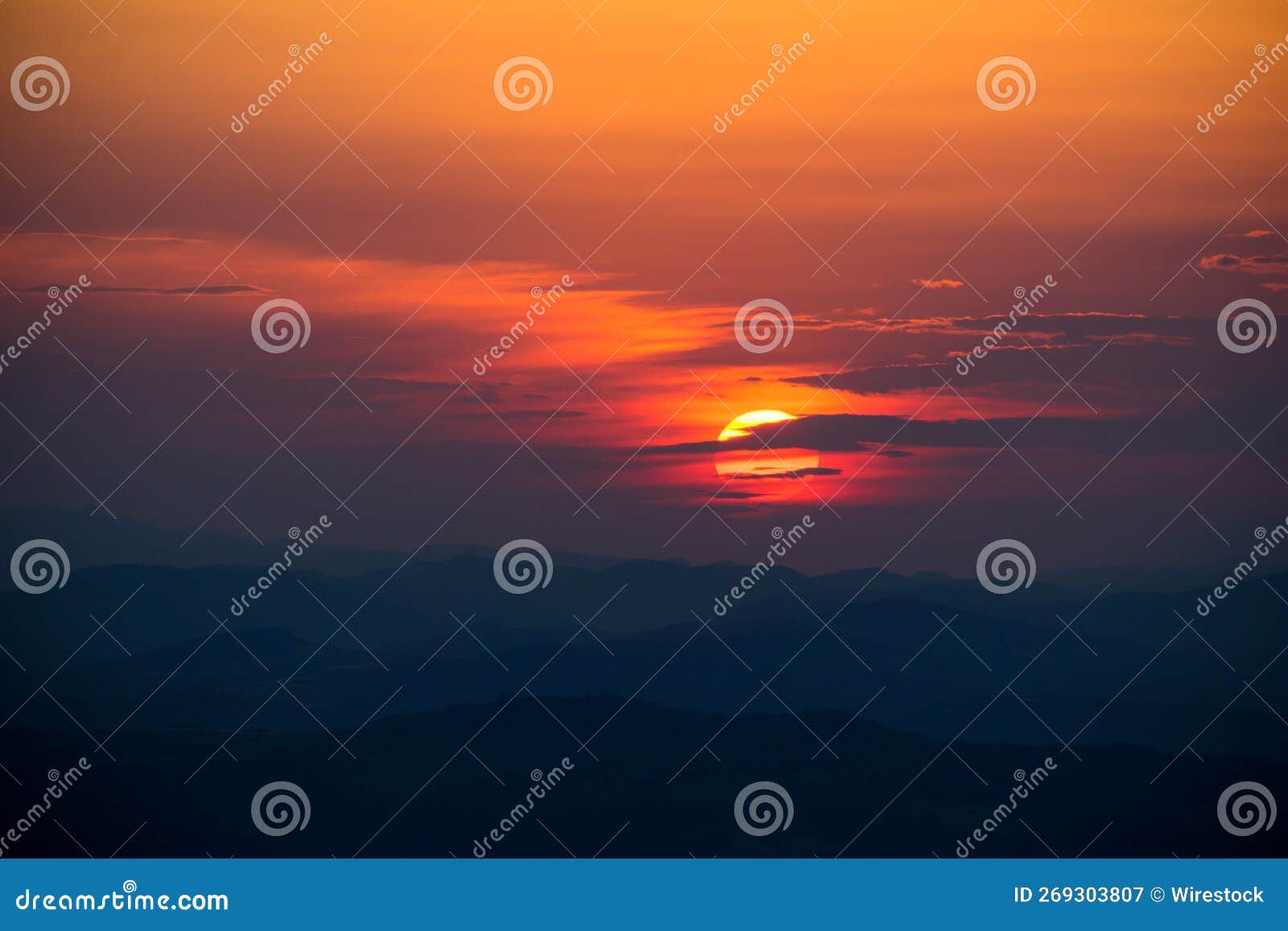 Red Sun Setting Behind Mountain and Making Clouds Red Stock Image ...