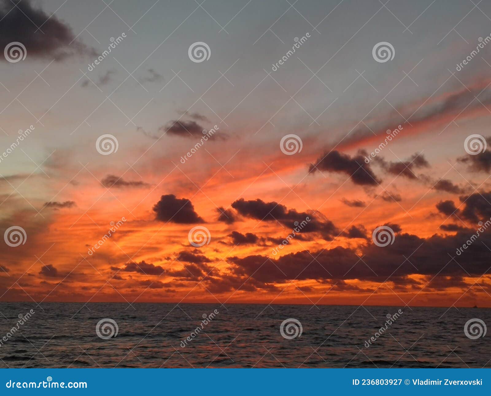 Red sunset in the ocean stock image. Image of sunrise - 236803927
