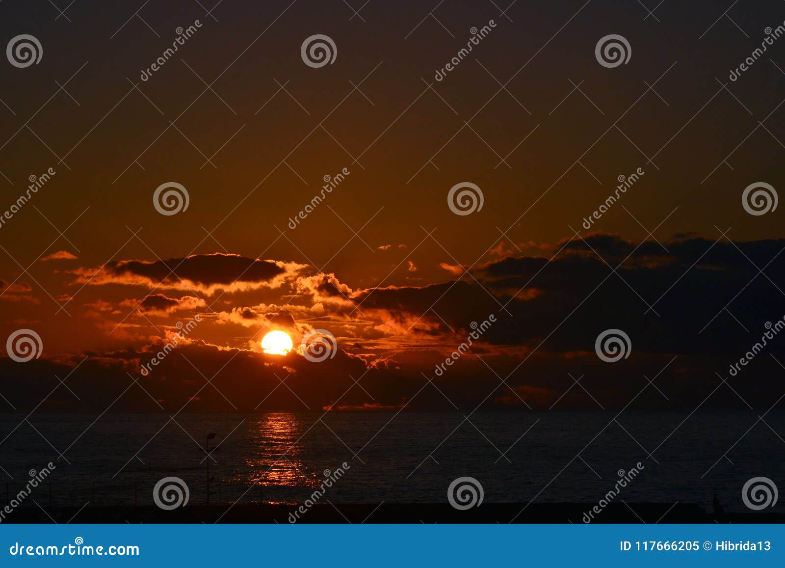 Red sunset over the ocean stock image. Image of silhouette - 117666205