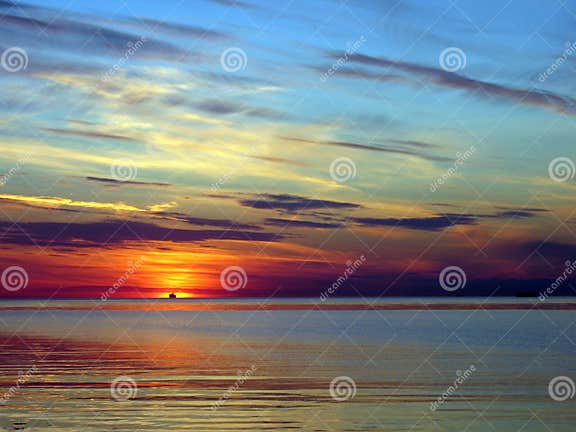 Red sunset over sea stock photo. Image of dramatic, ripples - 251884