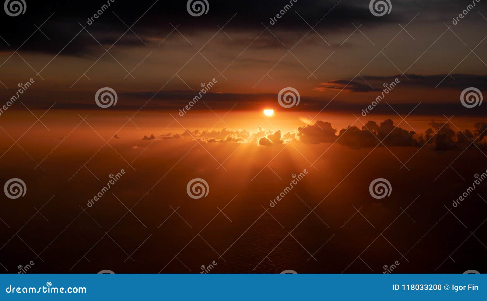 The Red Sunset of the Sun in the Sky OVER the CLOUDS Stock Photo ...