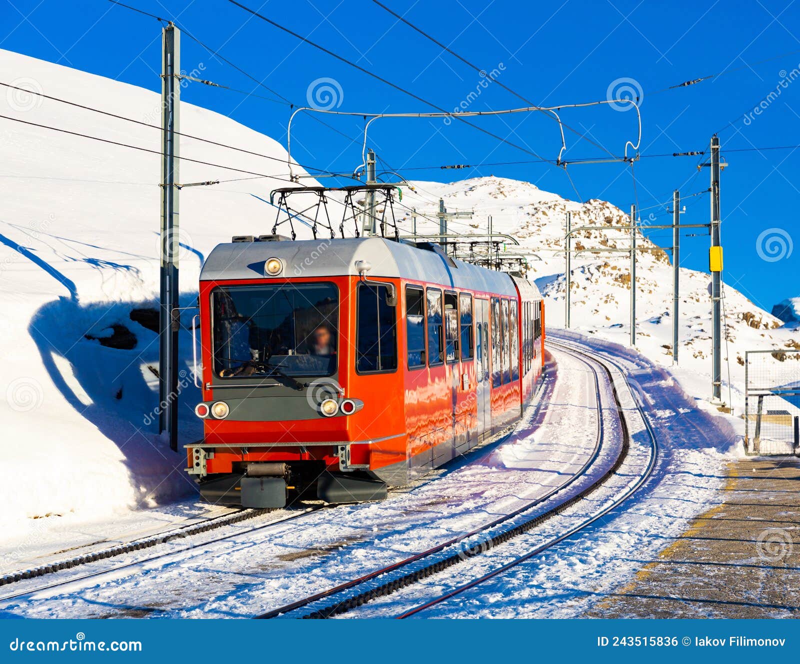 Red Swiss Train Running through Snow Stock Photo - Image of electric ...