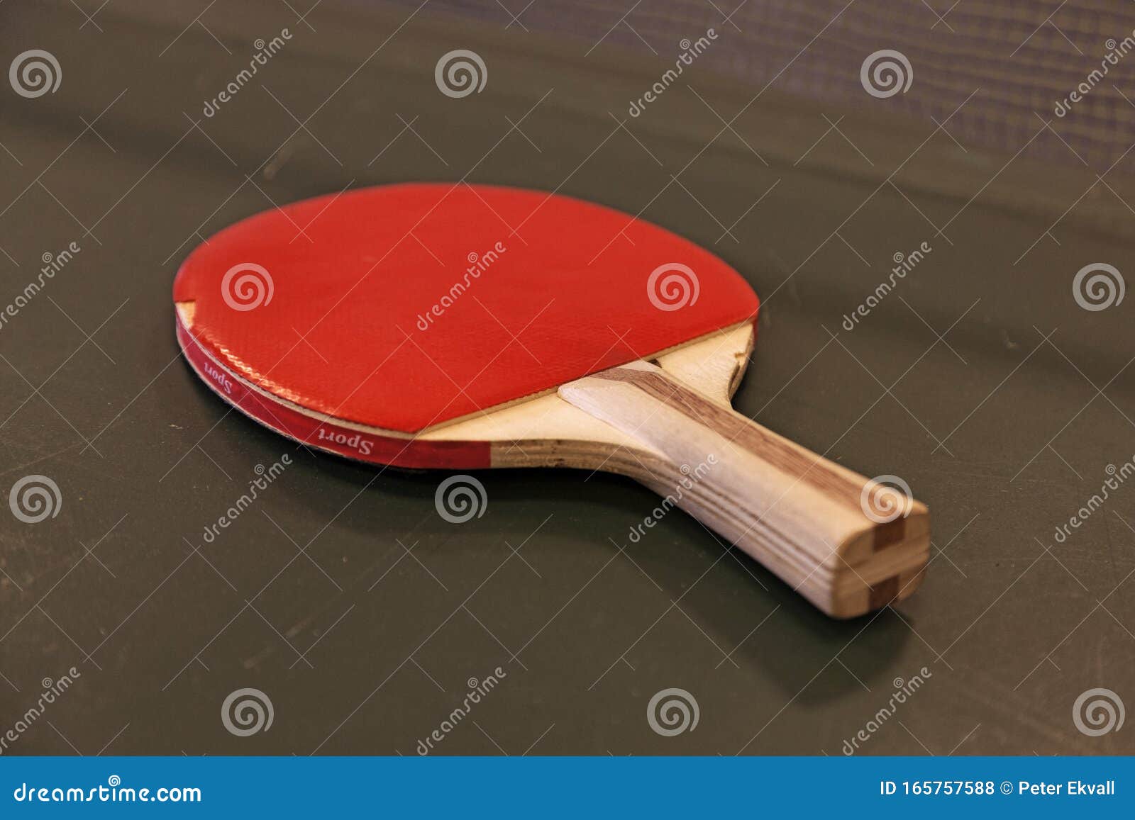 A Red Table Tennis Racket on a Green Ping Pong Table Stock Photo ...