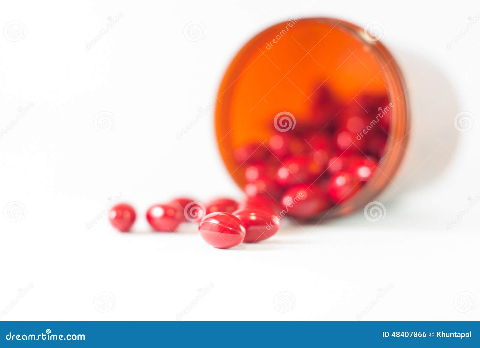 Red Tablet and Medicine Brown Bottle Stock Photo - Image of ...