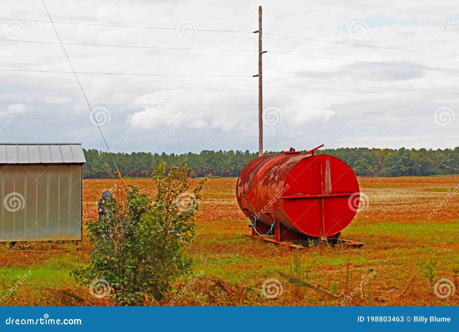 A red tank in a field stock image. Image of water, station - 198803463