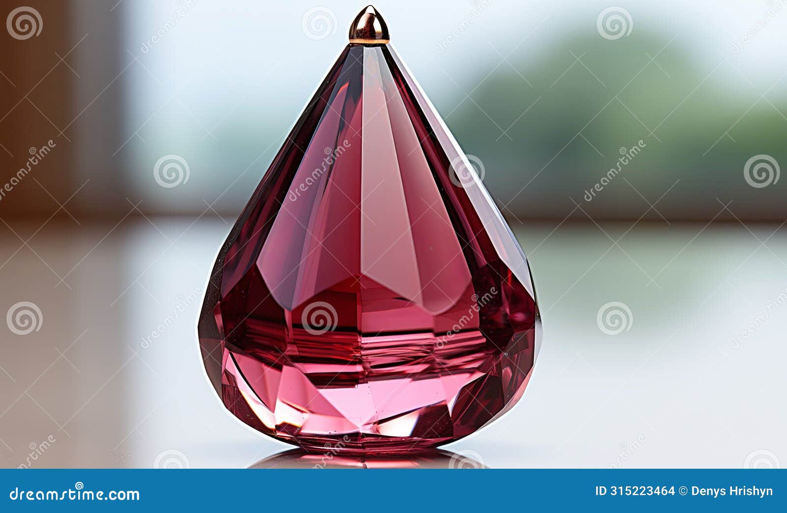 Red Tear-Shaped Object on Table Stock Photo - Image of background ...