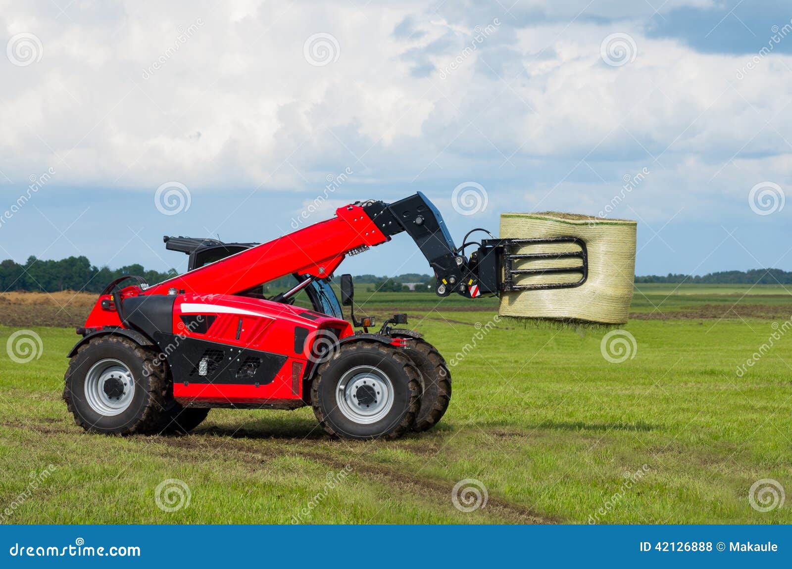 Telescopic Handler At Work Inside A Large A Large Industrial Building ...
