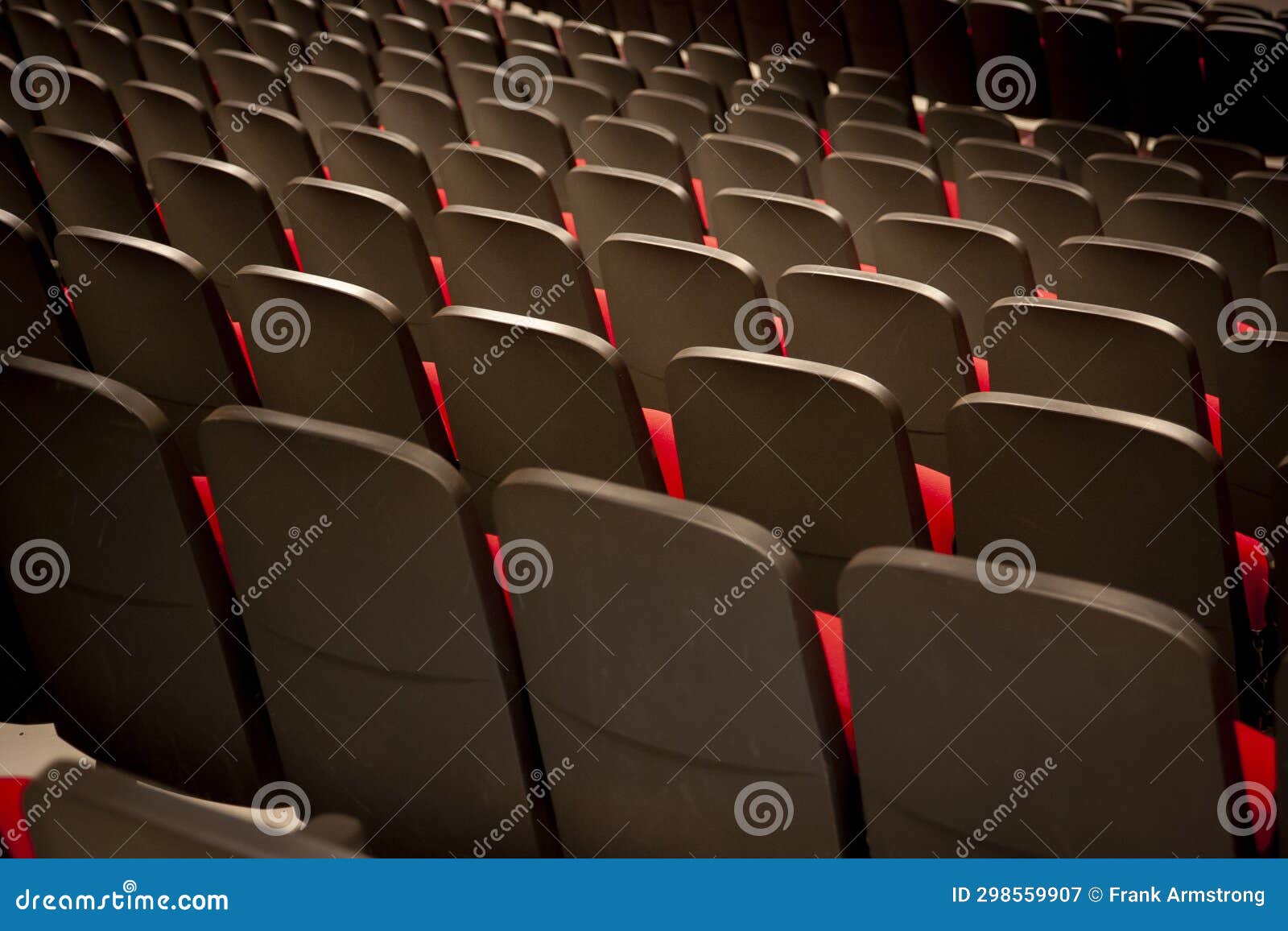 Red theater seats in rows stock image. Image of conference - 298559907