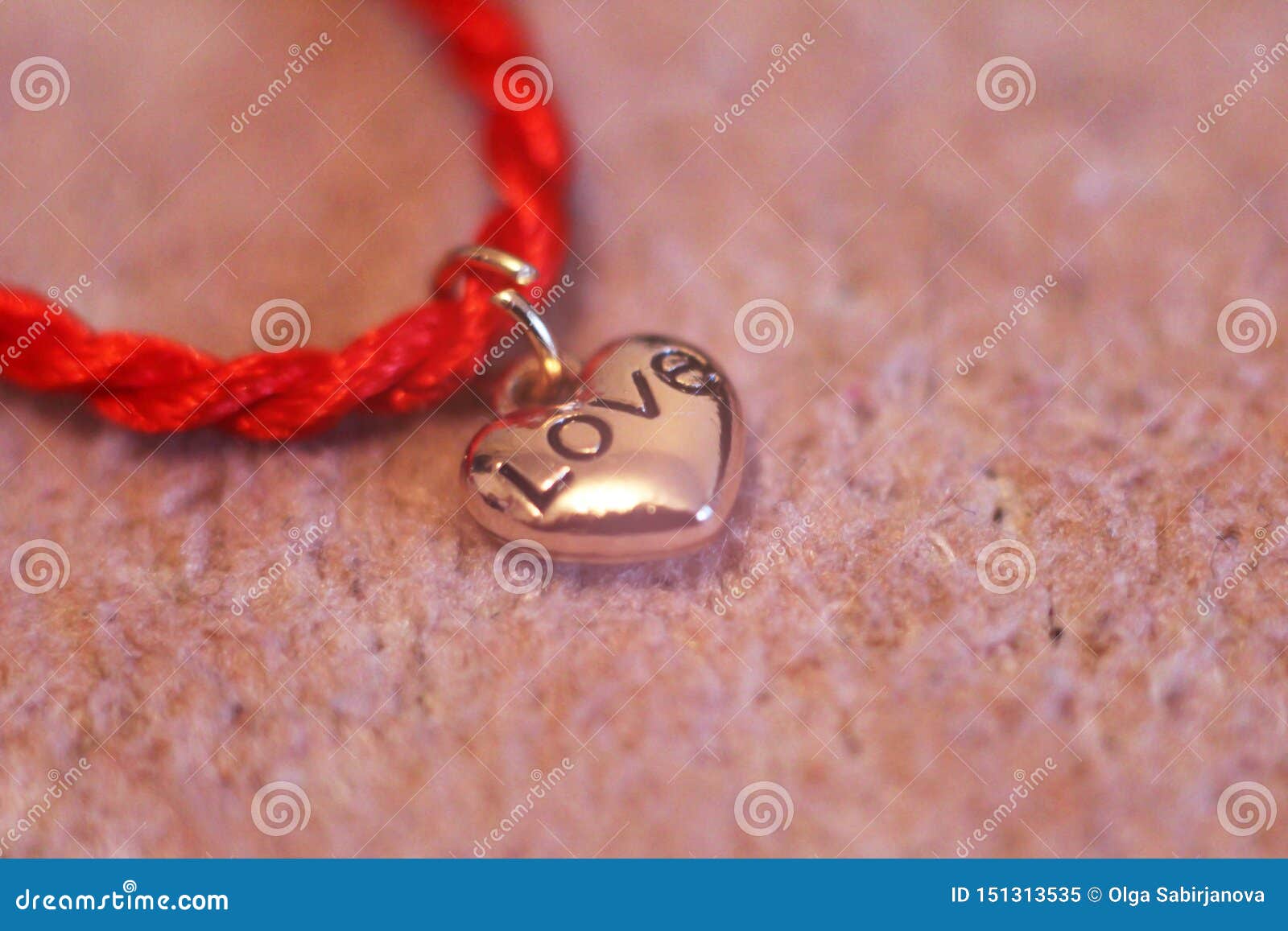 Red Thread for Hand with a Heart of Gold Stock Image - Image of hand ...