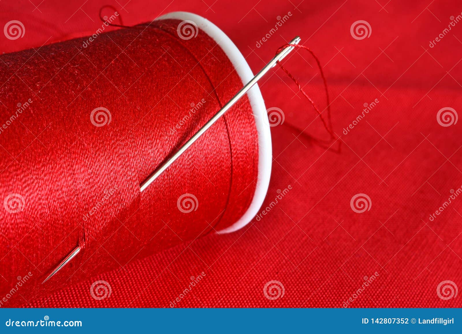 Red Thread and Sewing Needle Stock Photo - Image of design, color ...