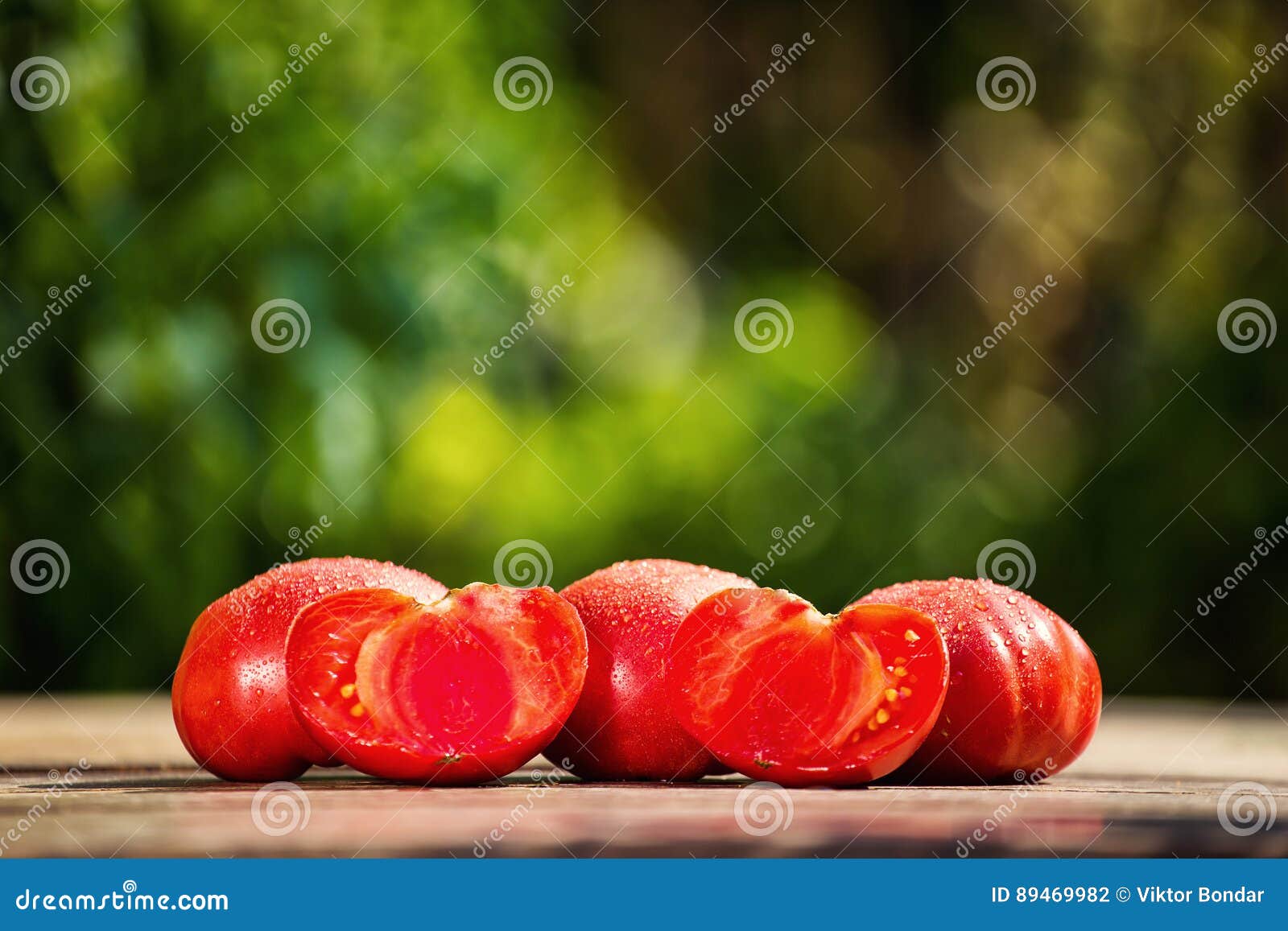 Red Tomatoes on the Table on a Green Background Stock Photo - Image of ...