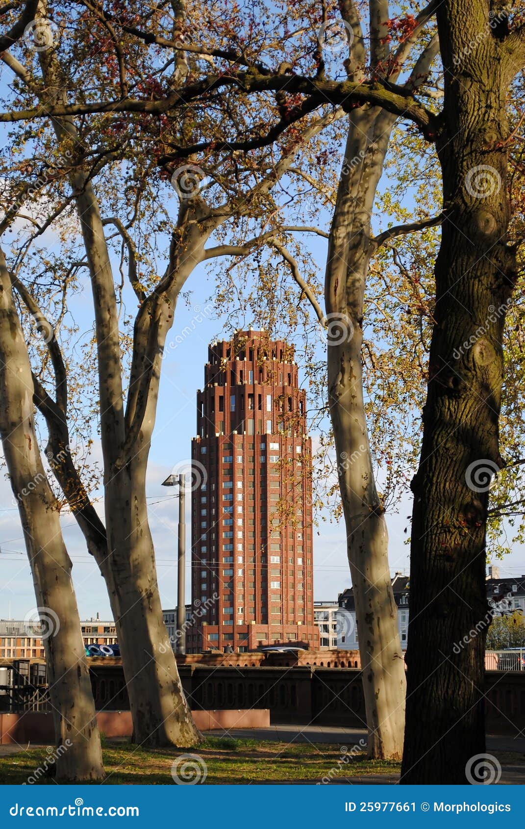 Red Tower Seen through Trees Stock Image - Image of cloud, construction ...