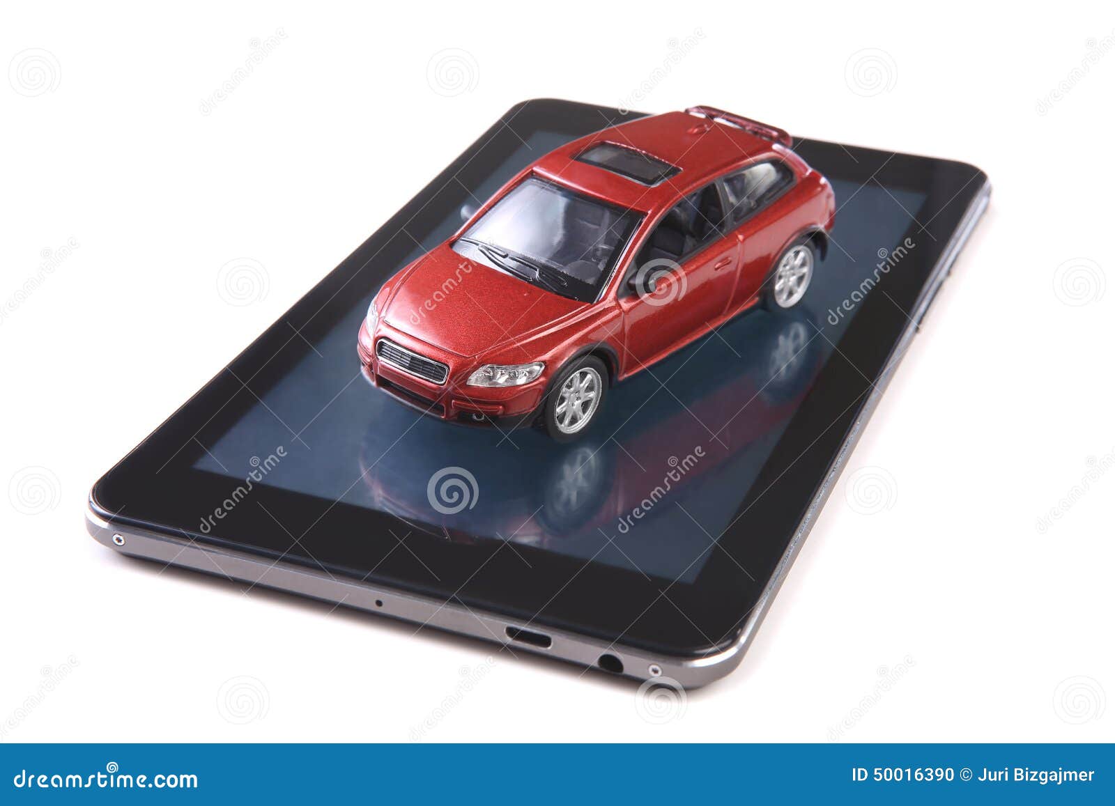 Red toy car on tablet stock photo. Image of door, electronics - 50016390
