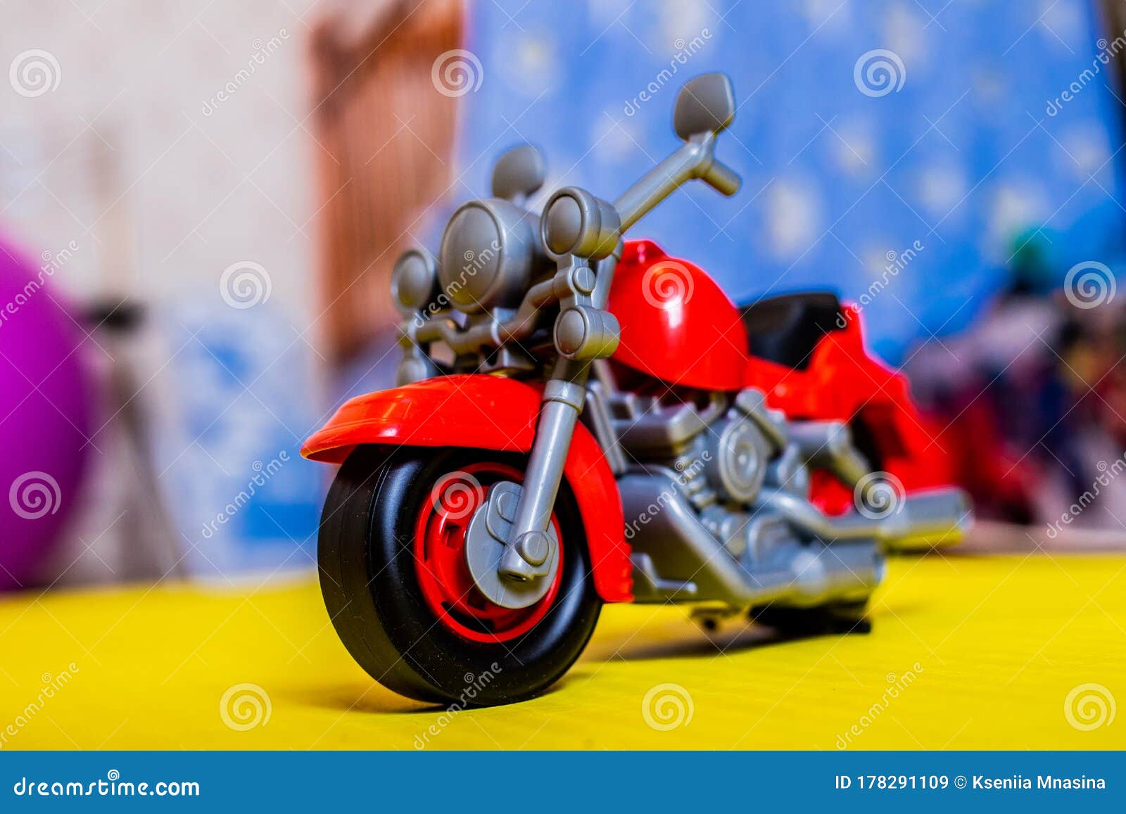 Red Toy Motorcycle on a Blurry Background. Stock Image - Image of ...