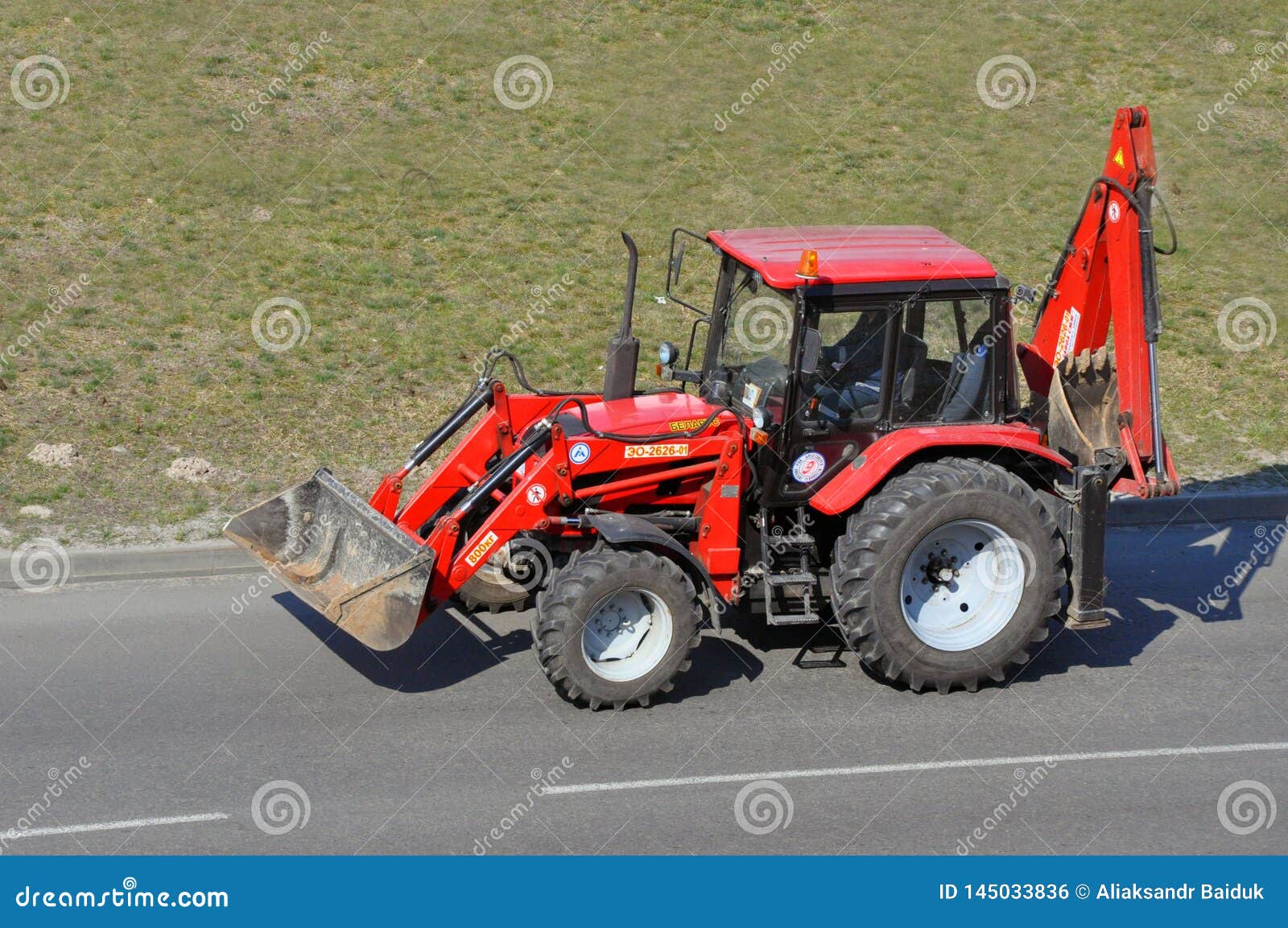 Red Tractor with Attachments on the Road Editorial Photo - Image of ...