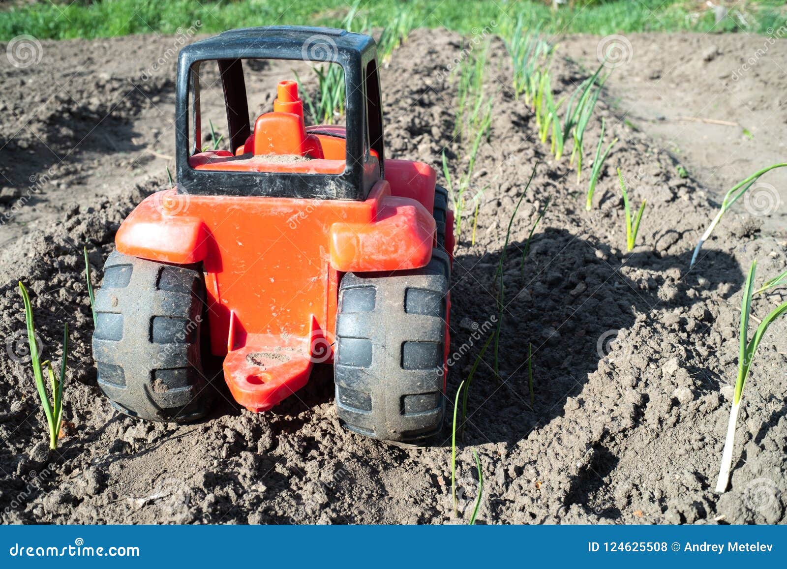 Red Tractor with Black Wheels, Toy Car on the Field Stock Photo - Image ...