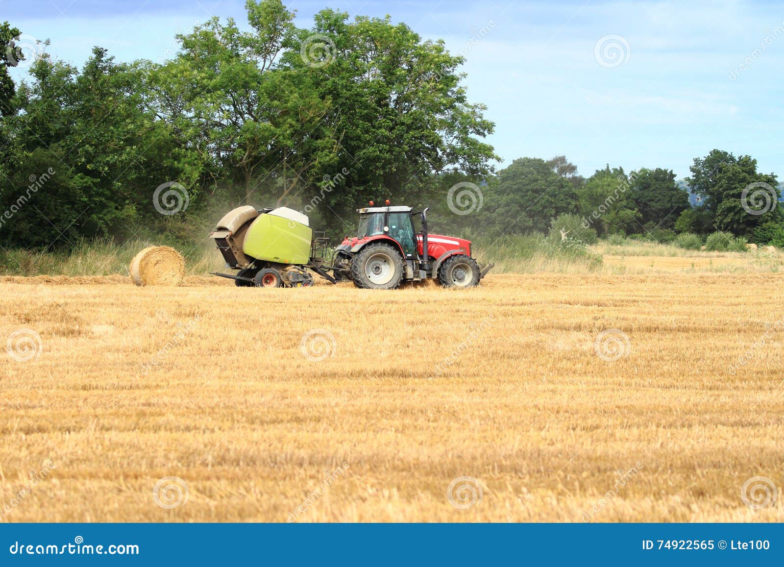 Red Tractor in Corn Field Bailing Hay Stock Image - Image of farming ...