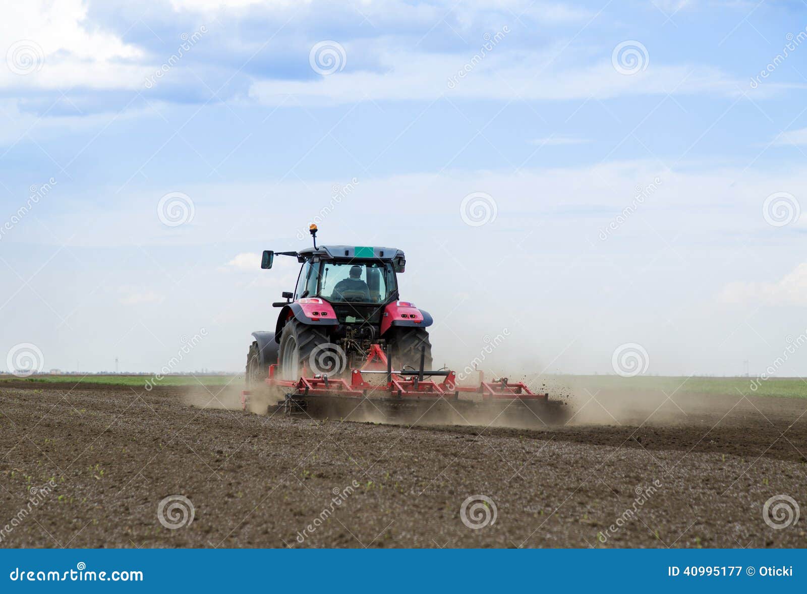 Red Tractor Driven by Farmer Cultivating Land Stock Image - Image of ...