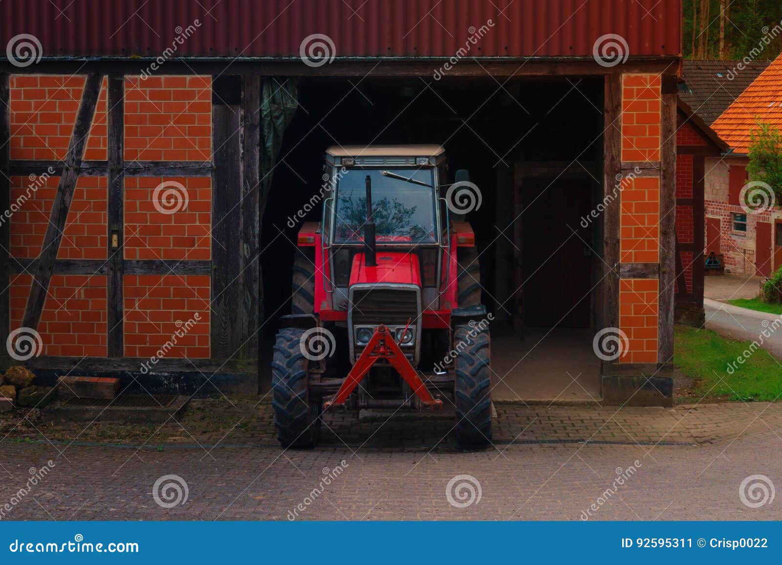 Red tractor on the farm stock image. Image of farmyard - 92595311
