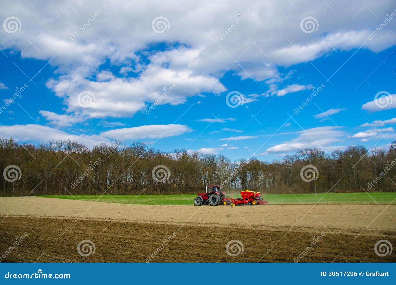 Red tractor on a field stock photo. Image of preparation - 30517296