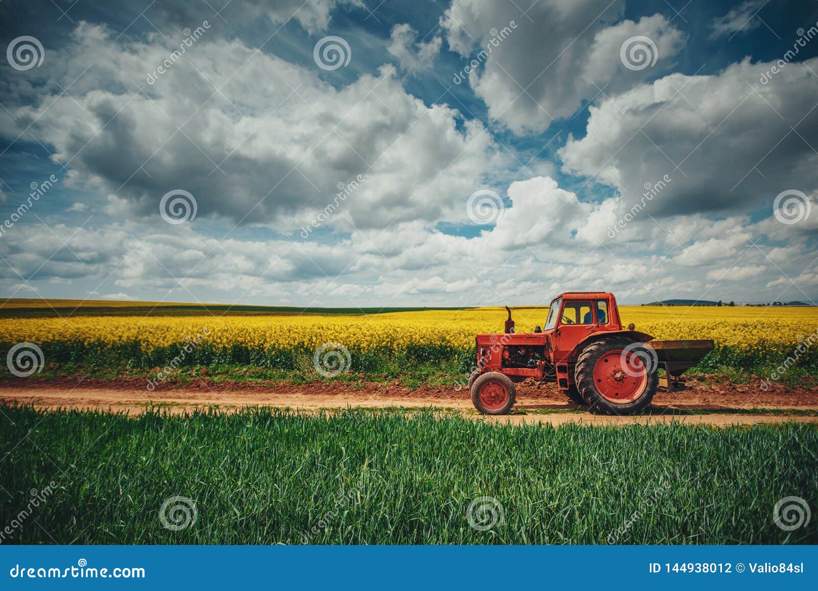 Red tractor in a field stock photo. Image of field, cultivating - 144938012
