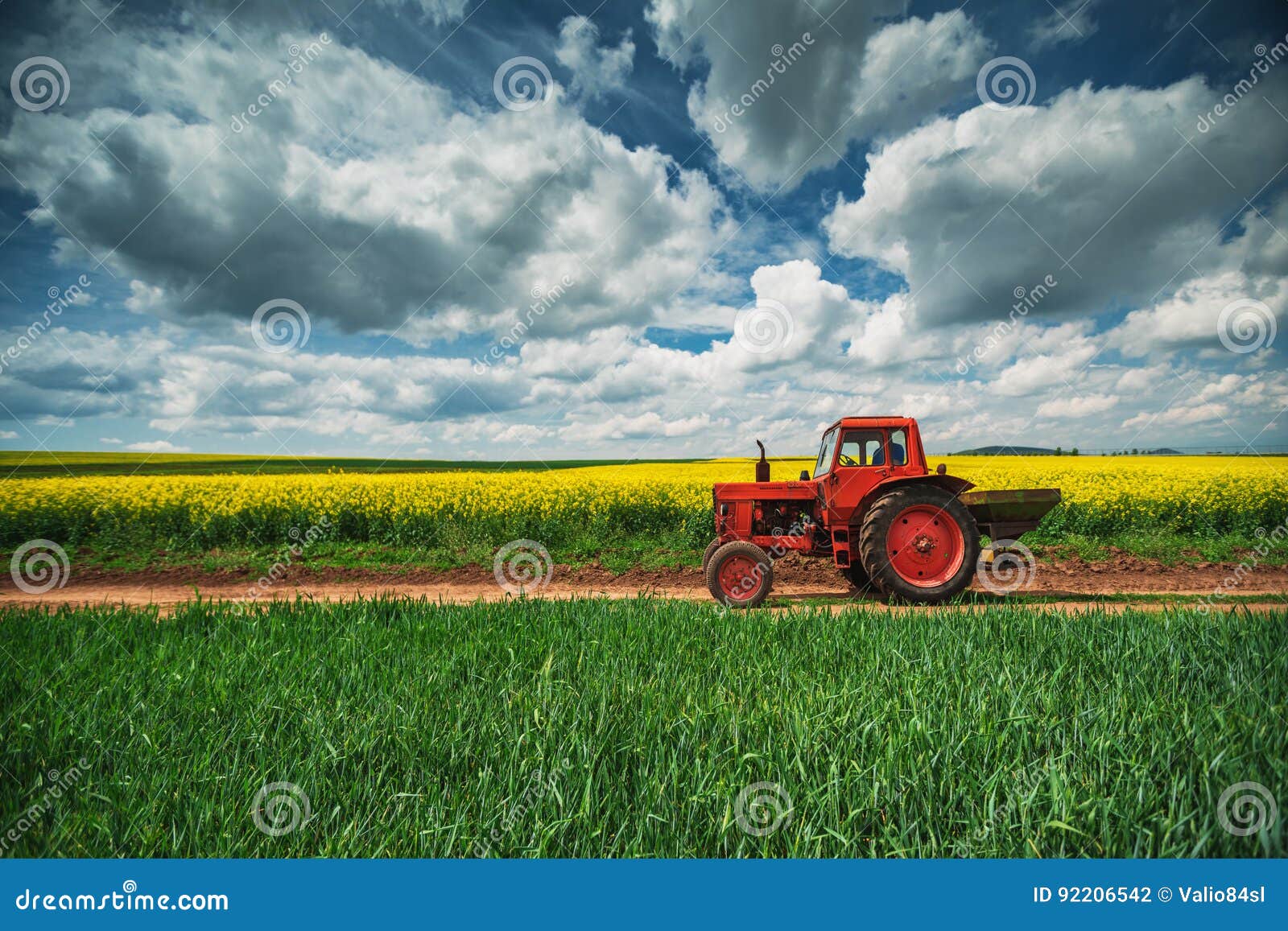 Tractor On A Field With Rainbow In The Background Royalty-Free Stock ...