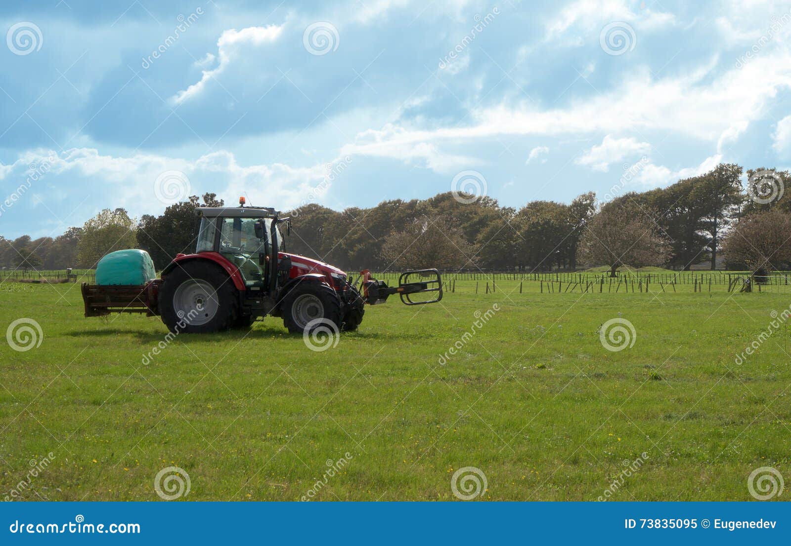 Red tractor on a field stock image. Image of grass, farmer - 73835095