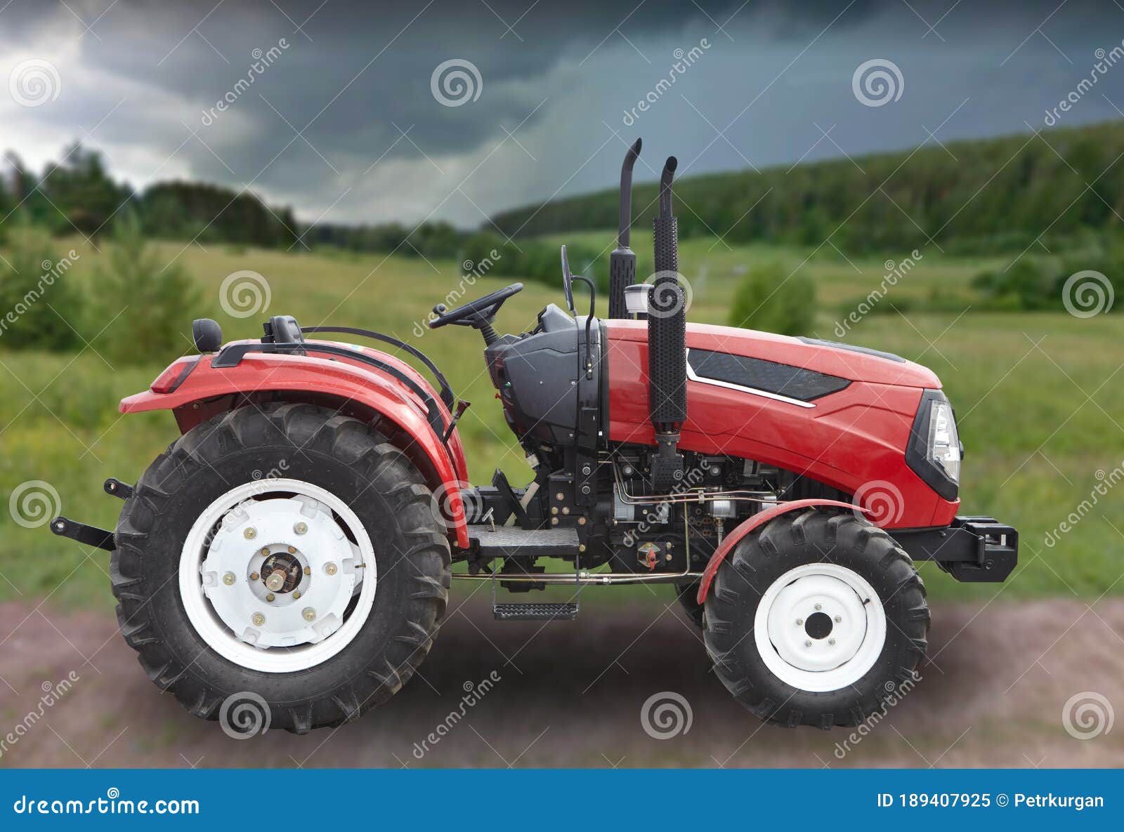 Red tractor on the field stock image. Image of farm - 189407925