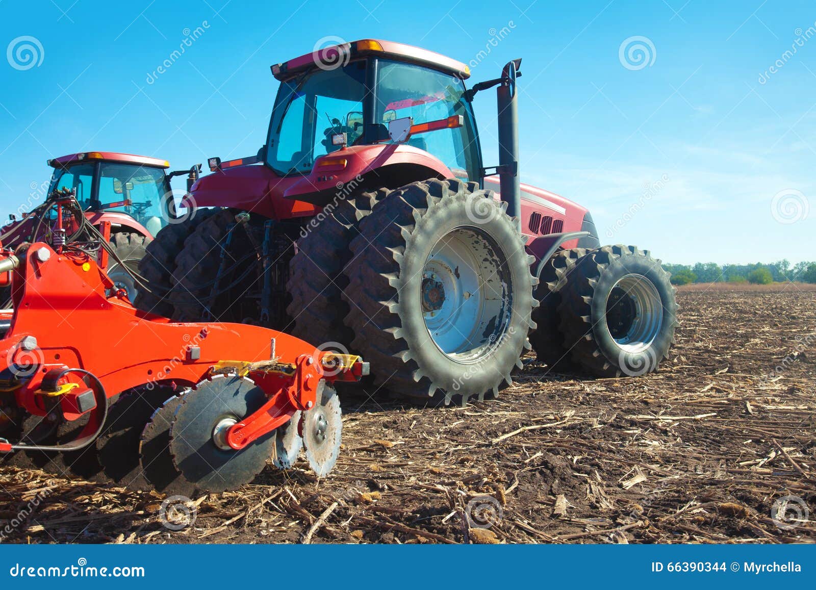 Red tractor in the field stock photo. Image of machine - 66390344
