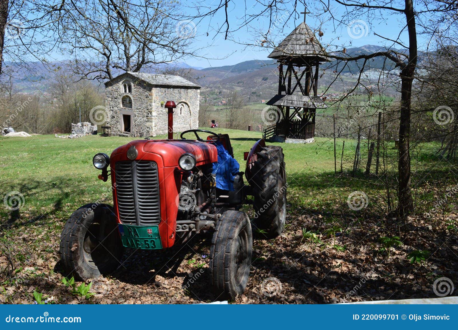 Red Tractor in Front of an Old Church Editorial Photo - Image of wall ...