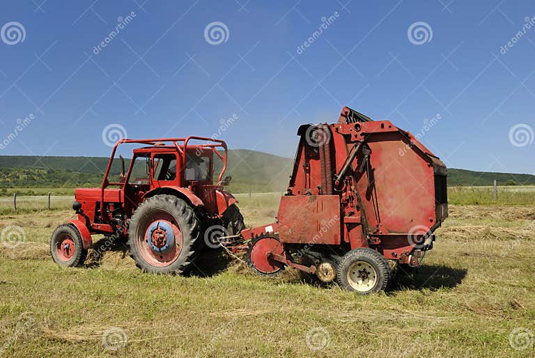 Red tractor and hay baler stock image. Image of machinery - 15274073
